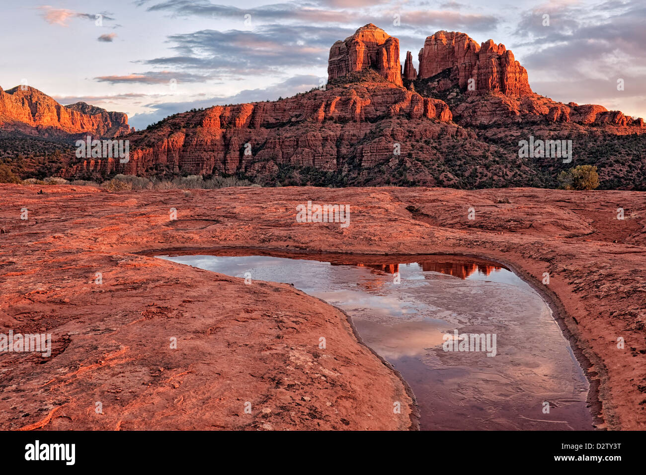 Last light bathes the icy reflection of Arizona’s Cathedral Rock and ...