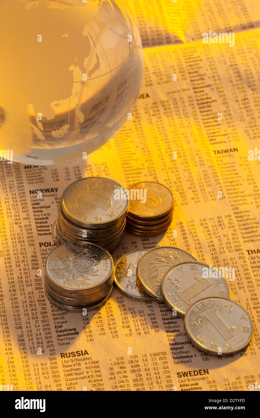 Glass globe on newspaper hi-res stock photography and images - Alamy