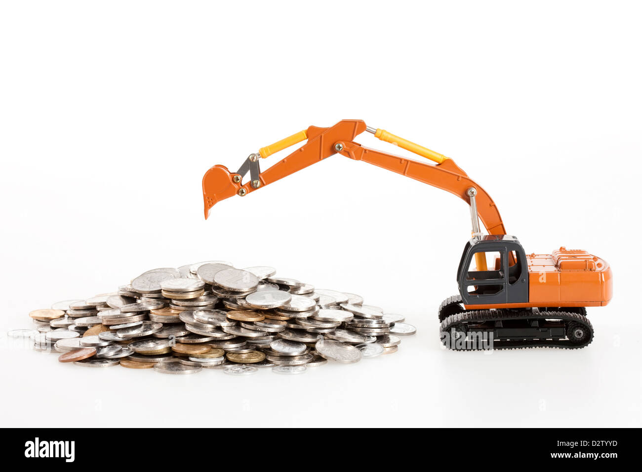 Excavator model and coins Stock Photo - Alamy