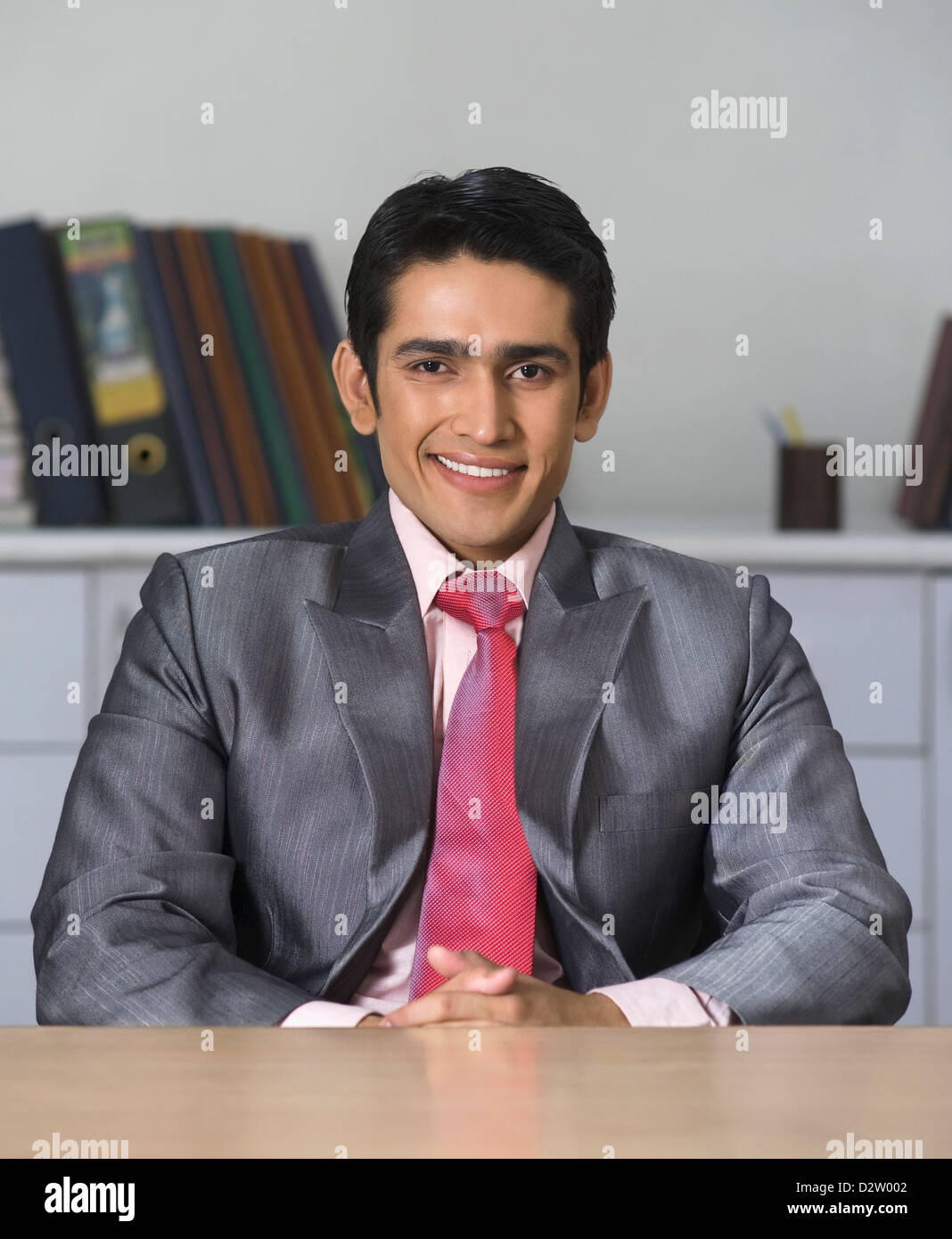 Portrait of a businessman smiling Stock Photo - Alamy