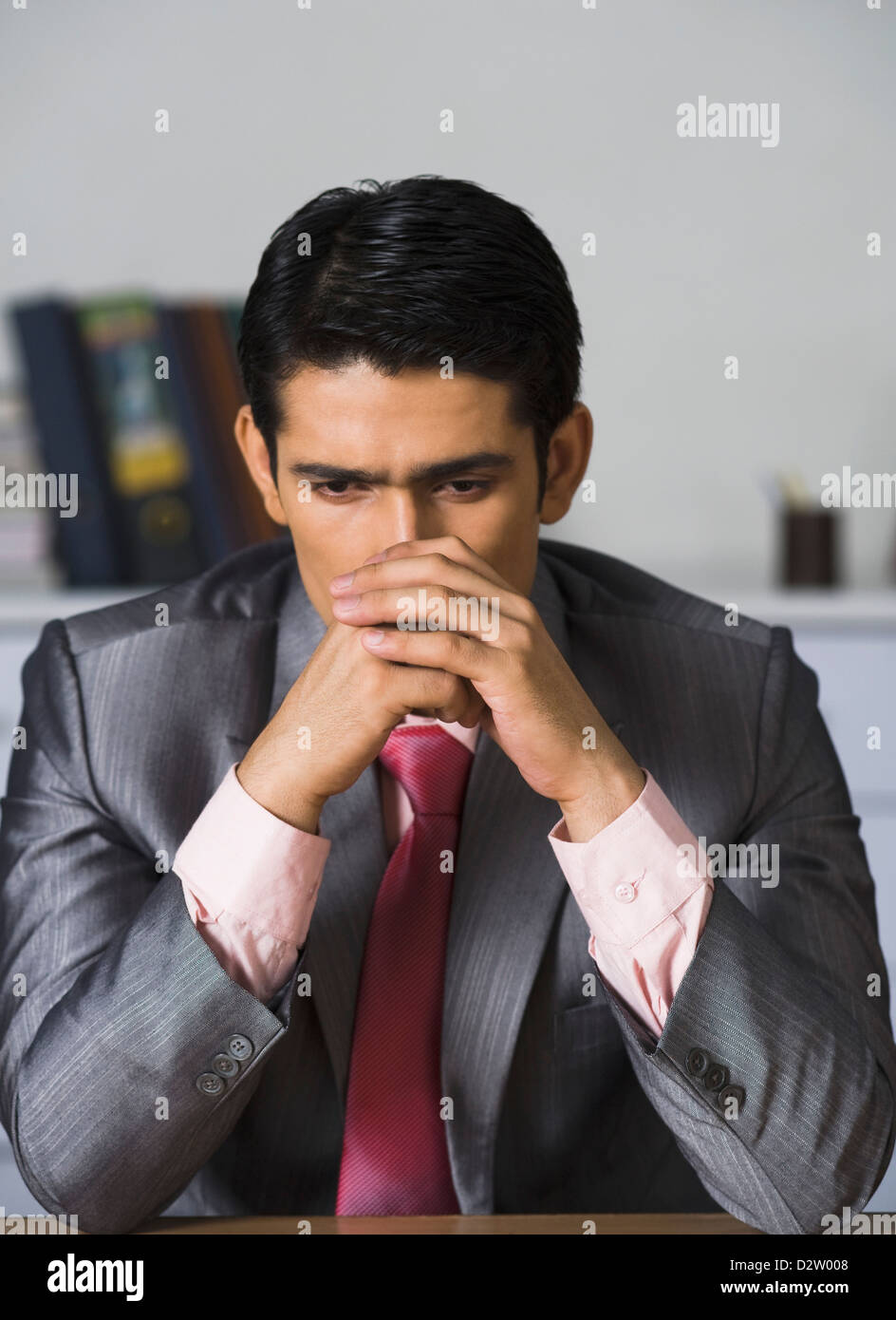 Businessman looking disappointed in an office Stock Photo - Alamy