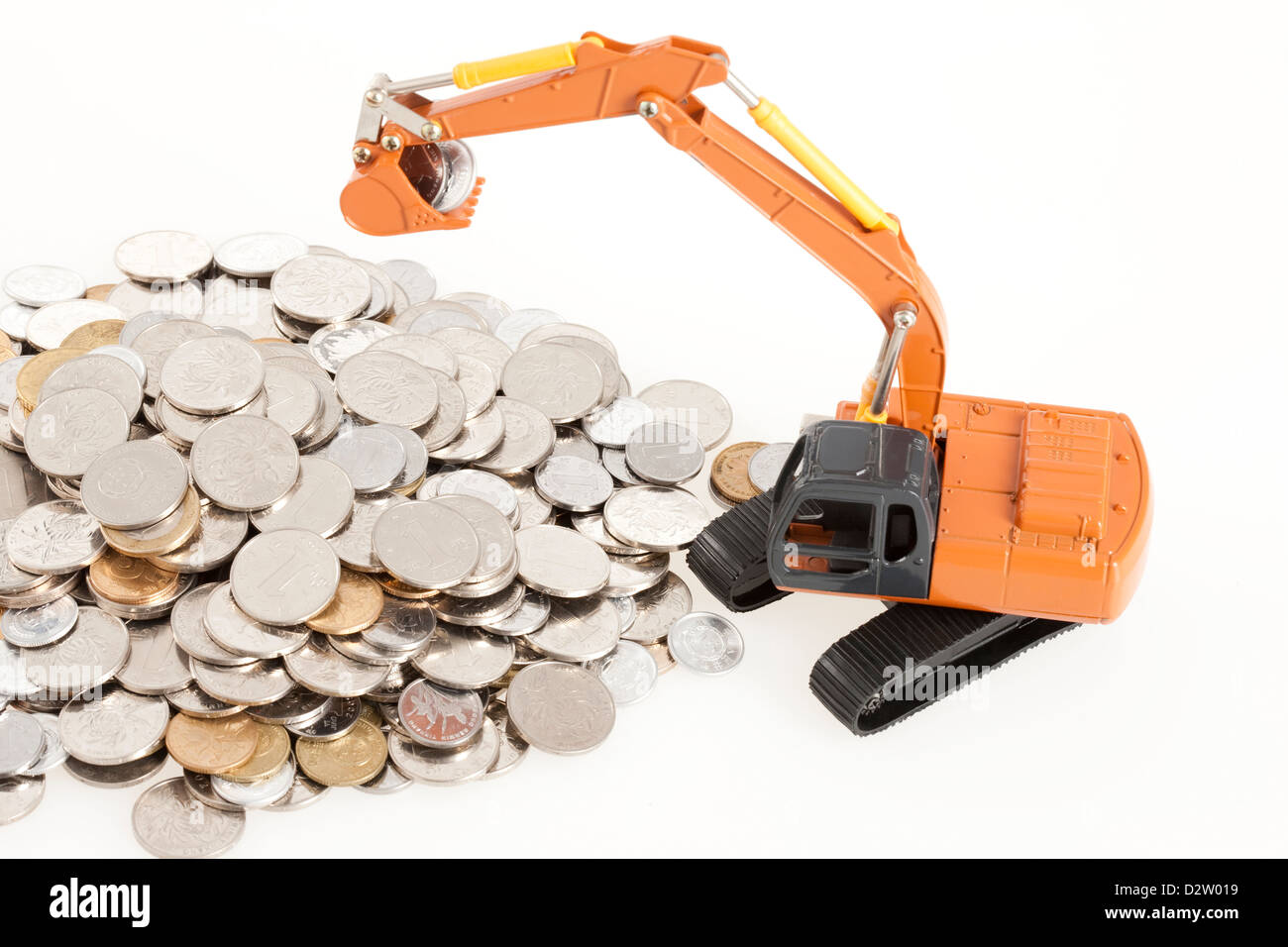 Excavator model and coins Stock Photo - Alamy