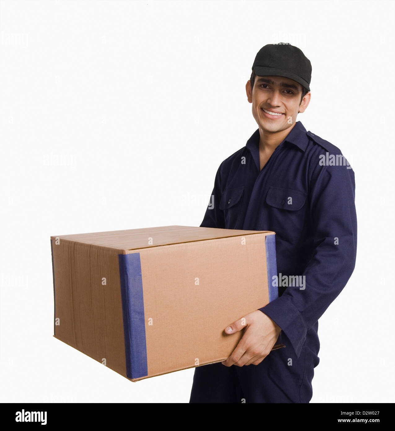 Delivery man holding a cardboard box Stock Photo - Alamy
