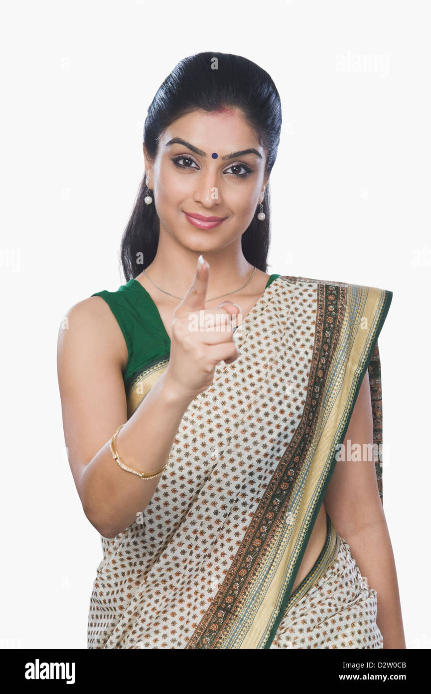 Portrait of a woman pointing forward Stock Photo - Alamy