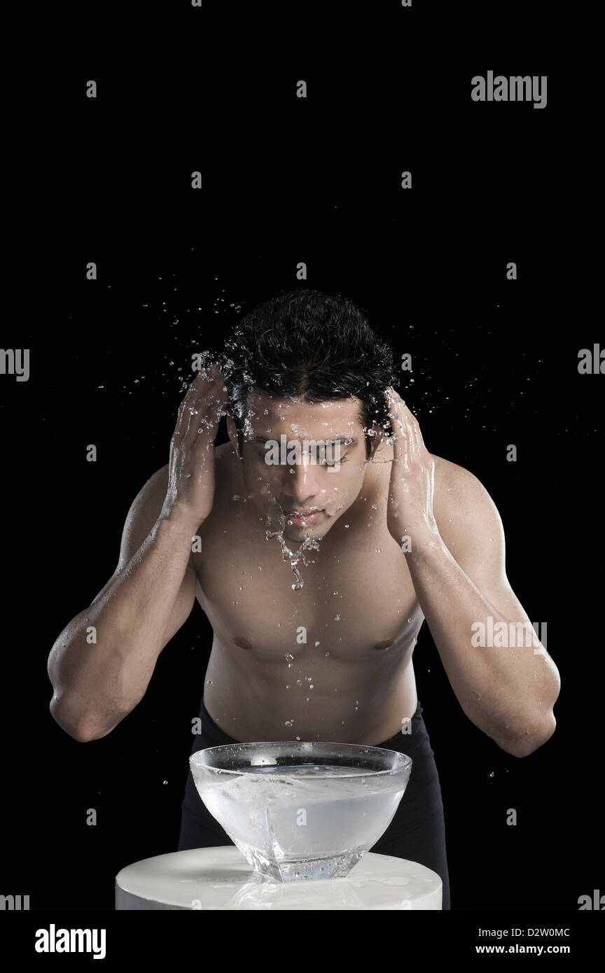 Man washing face Stock Photo - Alamy