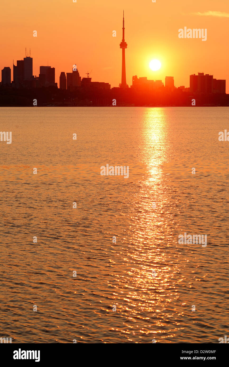 Toronto sunrise silhouette over lake with red tone Stock Photo - Alamy