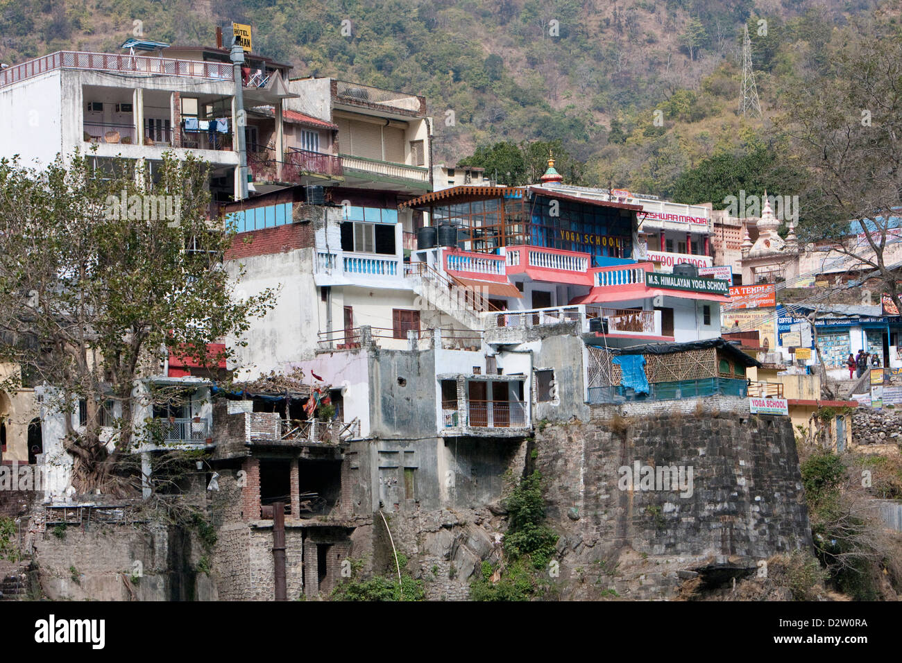 India, Rishikesh. Buildings on the Hillside leading down to the Ganges ...