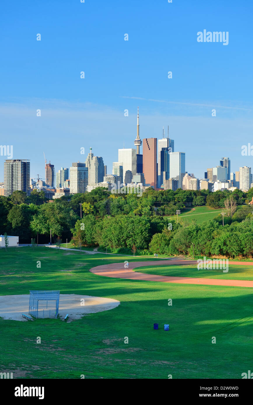 Toronto skyline over park with urban buildings and blue sky Stock Photo ...