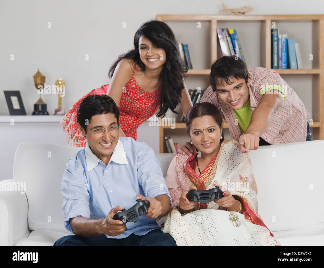 Family playing video game Stock Photo - Alamy