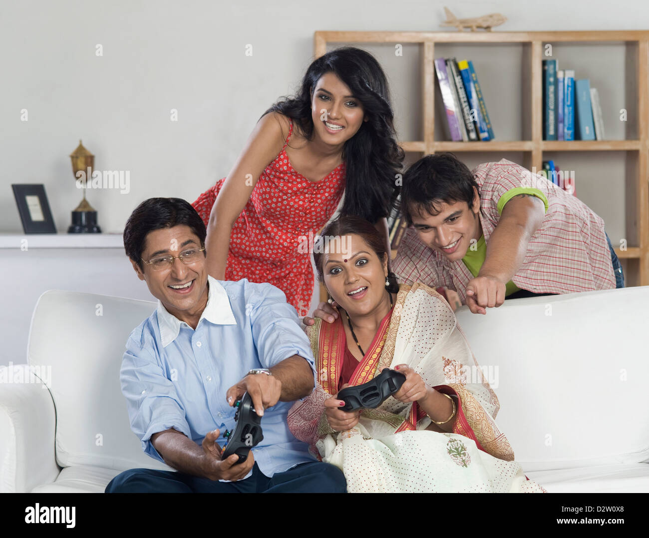 Family playing video game Stock Photo - Alamy