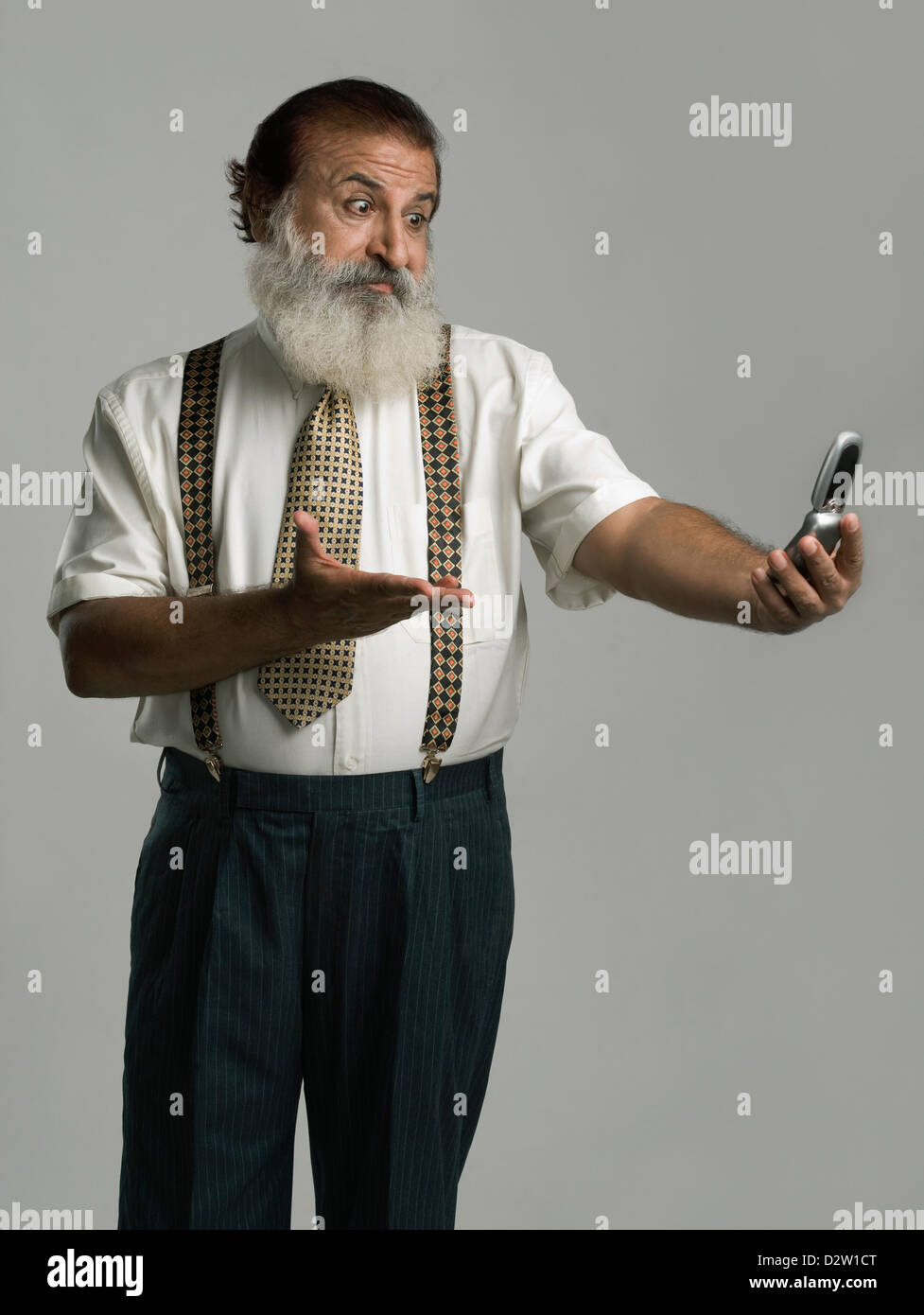 Man looking at a mobile phone Stock Photo - Alamy