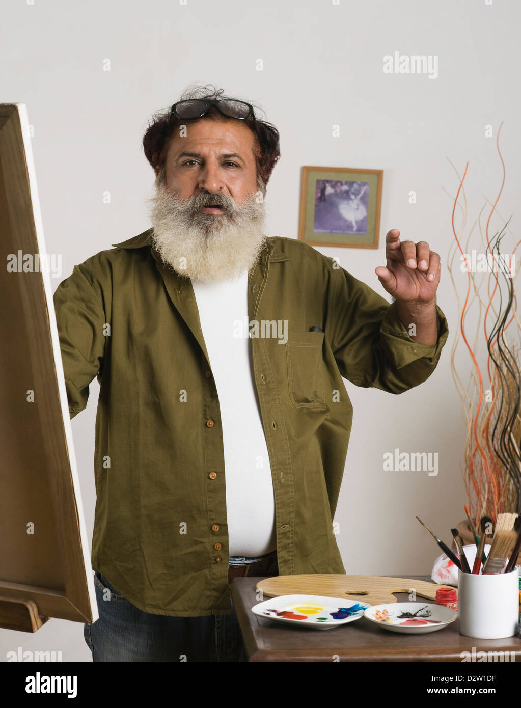 Man painting on a canvas Stock Photo - Alamy