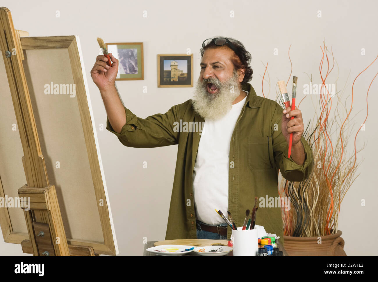 Painter getting excited to look his artwork Stock Photo - Alamy