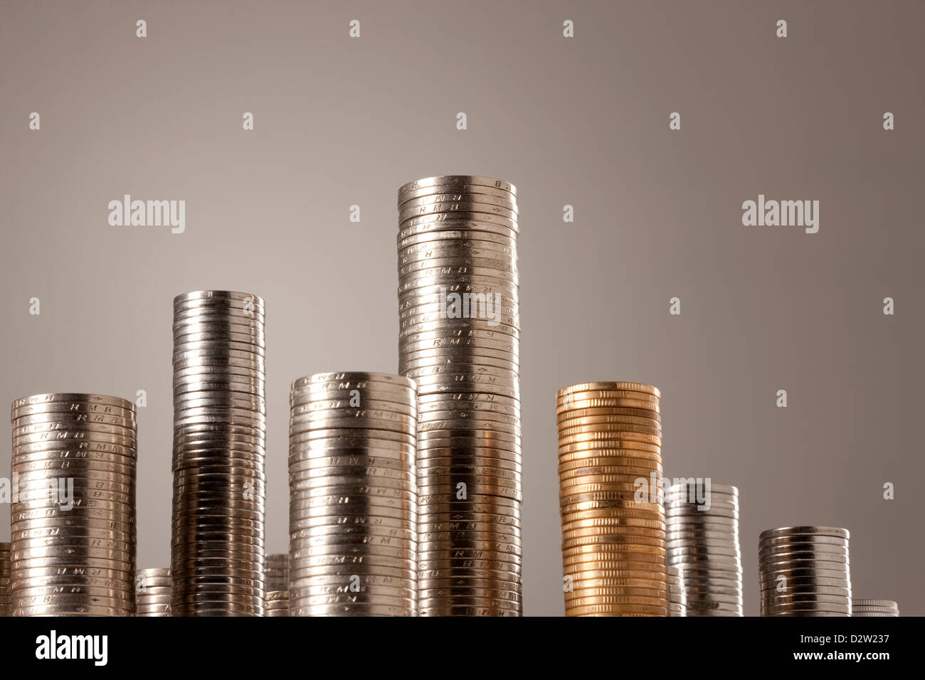 Large group of coins in city shape Stock Photo - Alamy