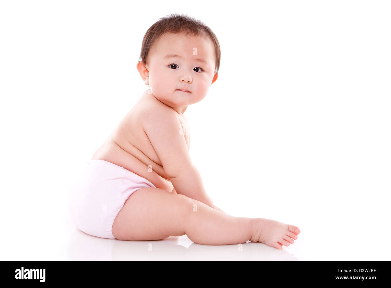 Portrait of cute baby girl looking over shoulder Stock Photo - Alamy