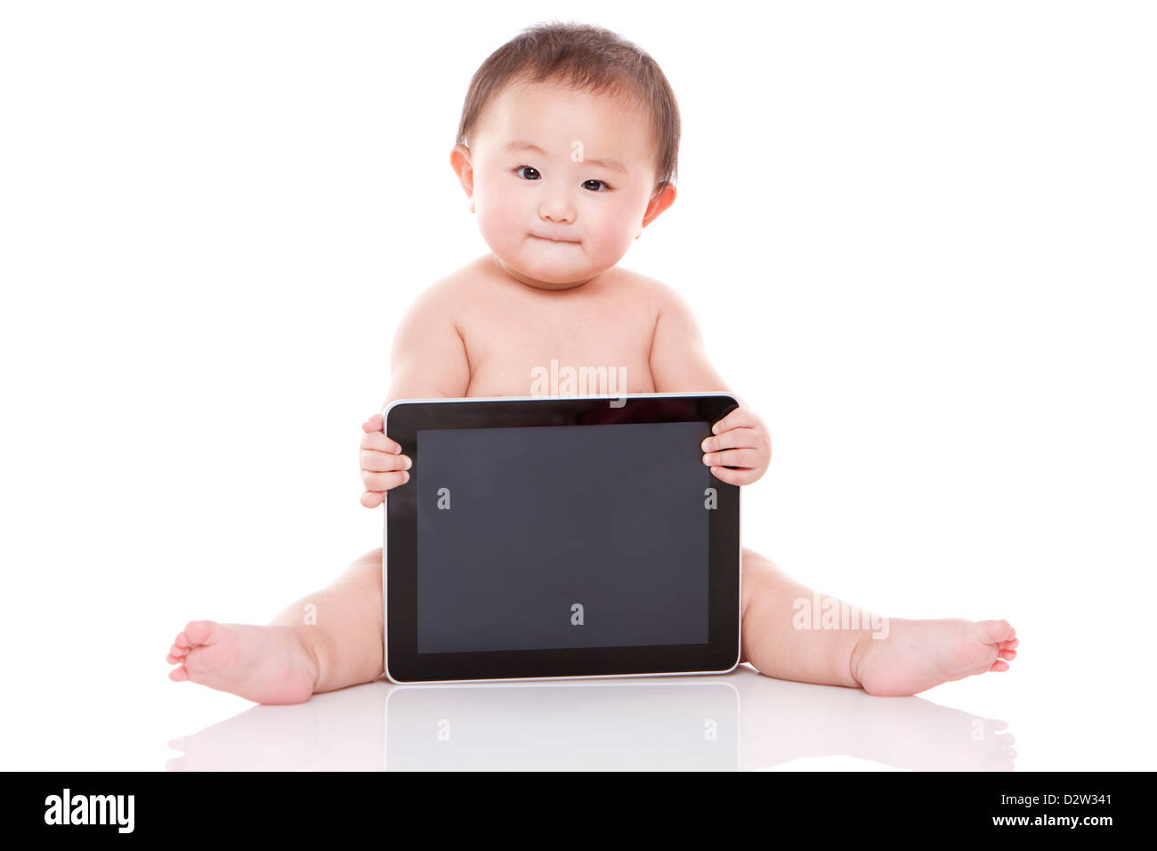 Cute baby girl with digital tablet Stock Photo - Alamy