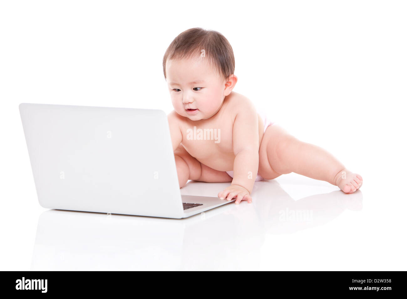 Cute baby girl with laptop Stock Photo - Alamy