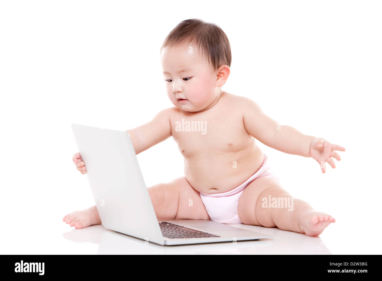 Cute baby girl with laptop Stock Photo - Alamy