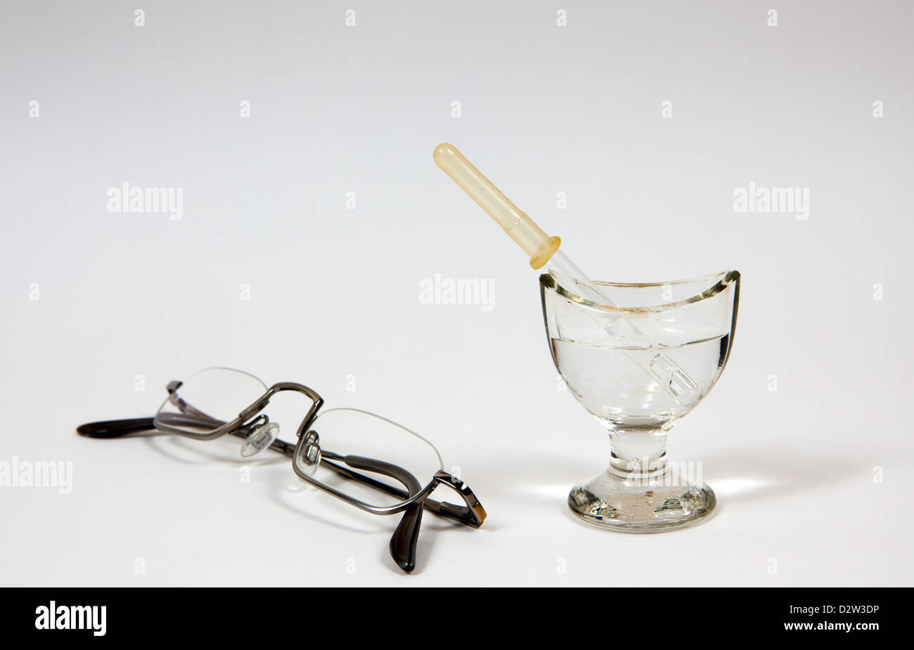 Medicine dropper, glasses and laboratory flask on white background ...