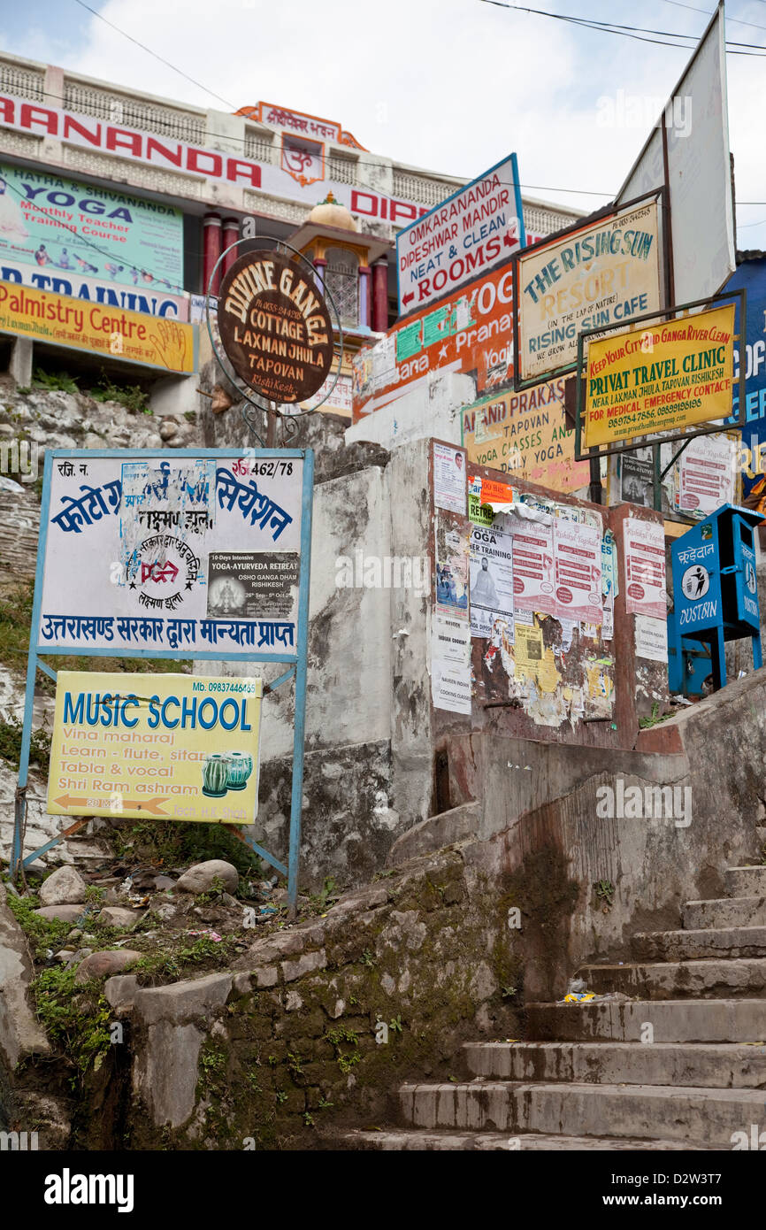 India, Rishikesh. Assorted Advertisements near the Footbridge over the ...
