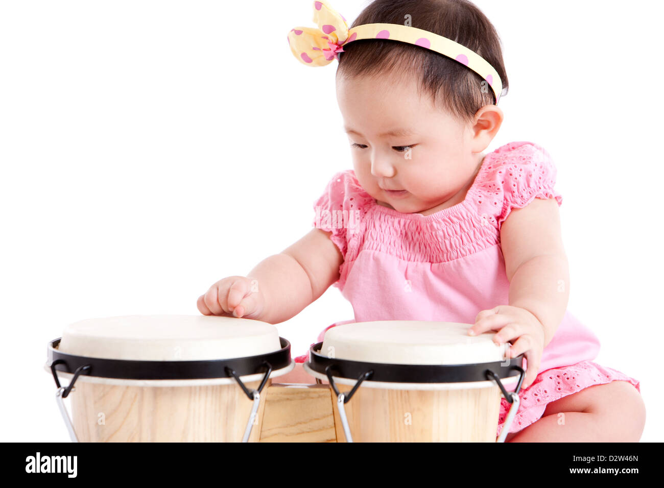 Cute baby girl with bongo Stock Photo - Alamy