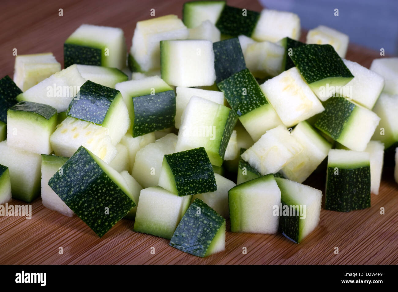 Close up of zucchini, or courgette, cut into small cubes Stock Photo ...