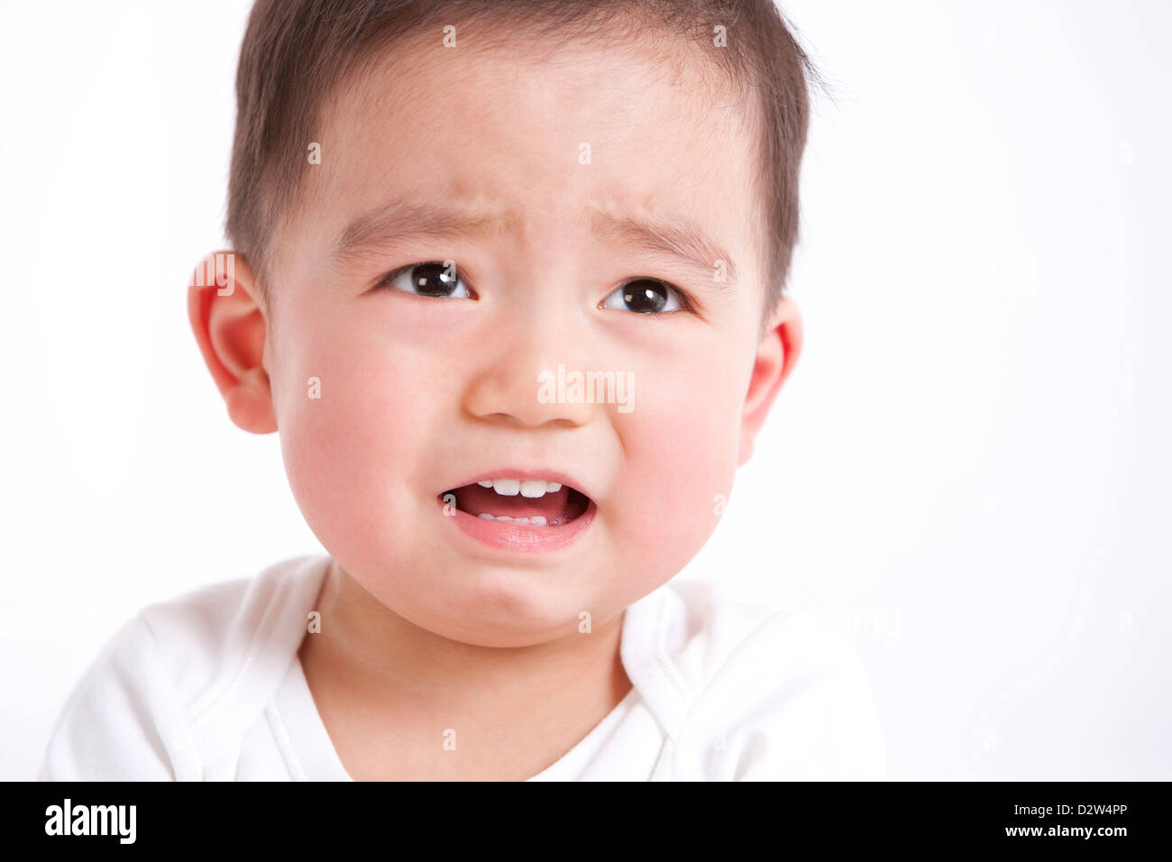 Cute baby boy about to cry Stock Photo - Alamy