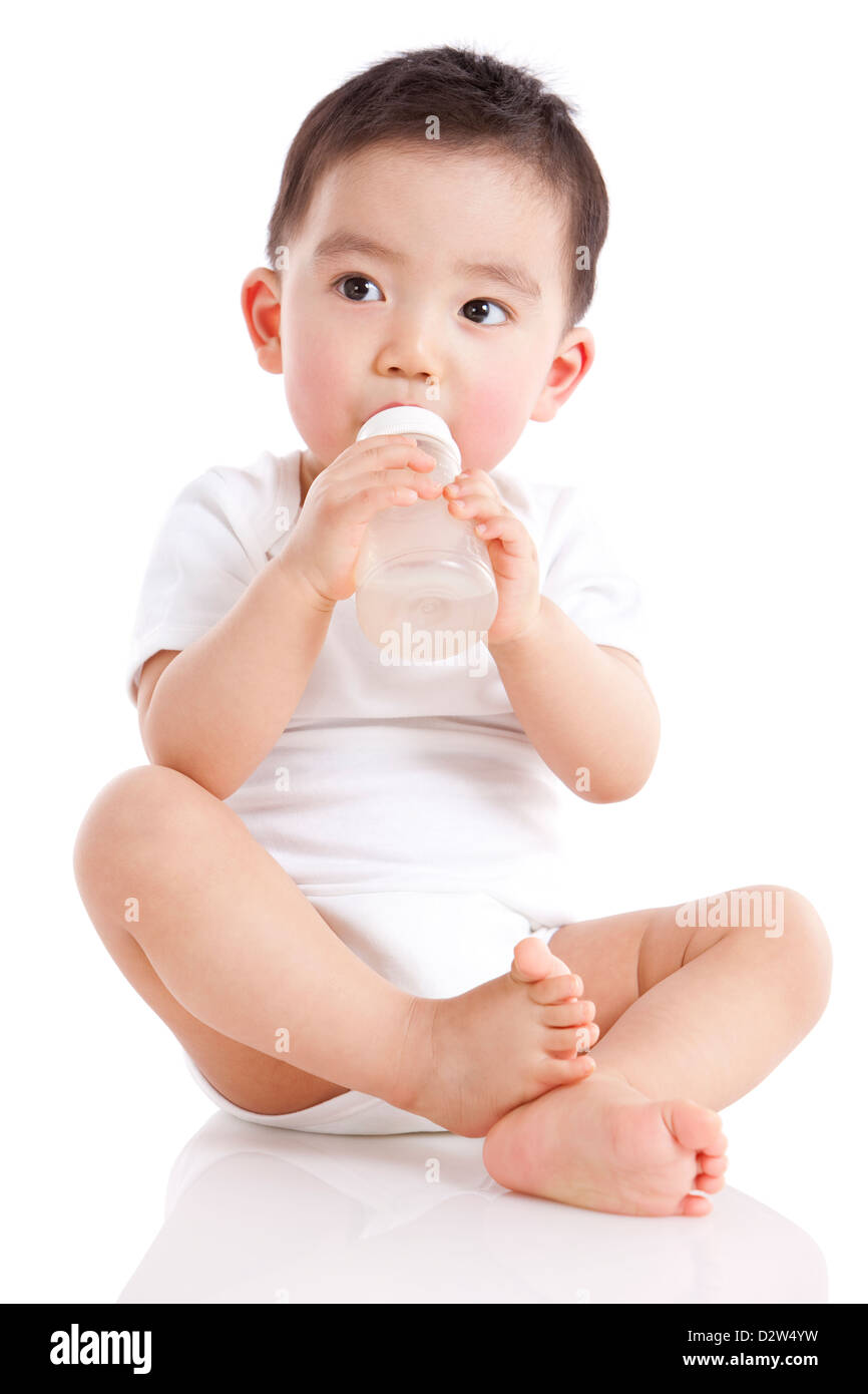 Cute baby boy with baby bottle Stock Photo - Alamy