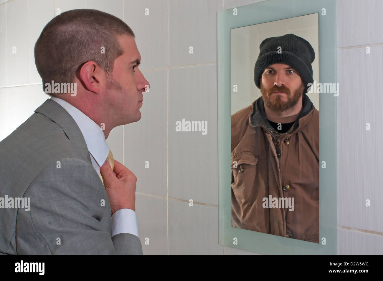 Business Man looking in the mirror and seeing a Tramp staring back in ...