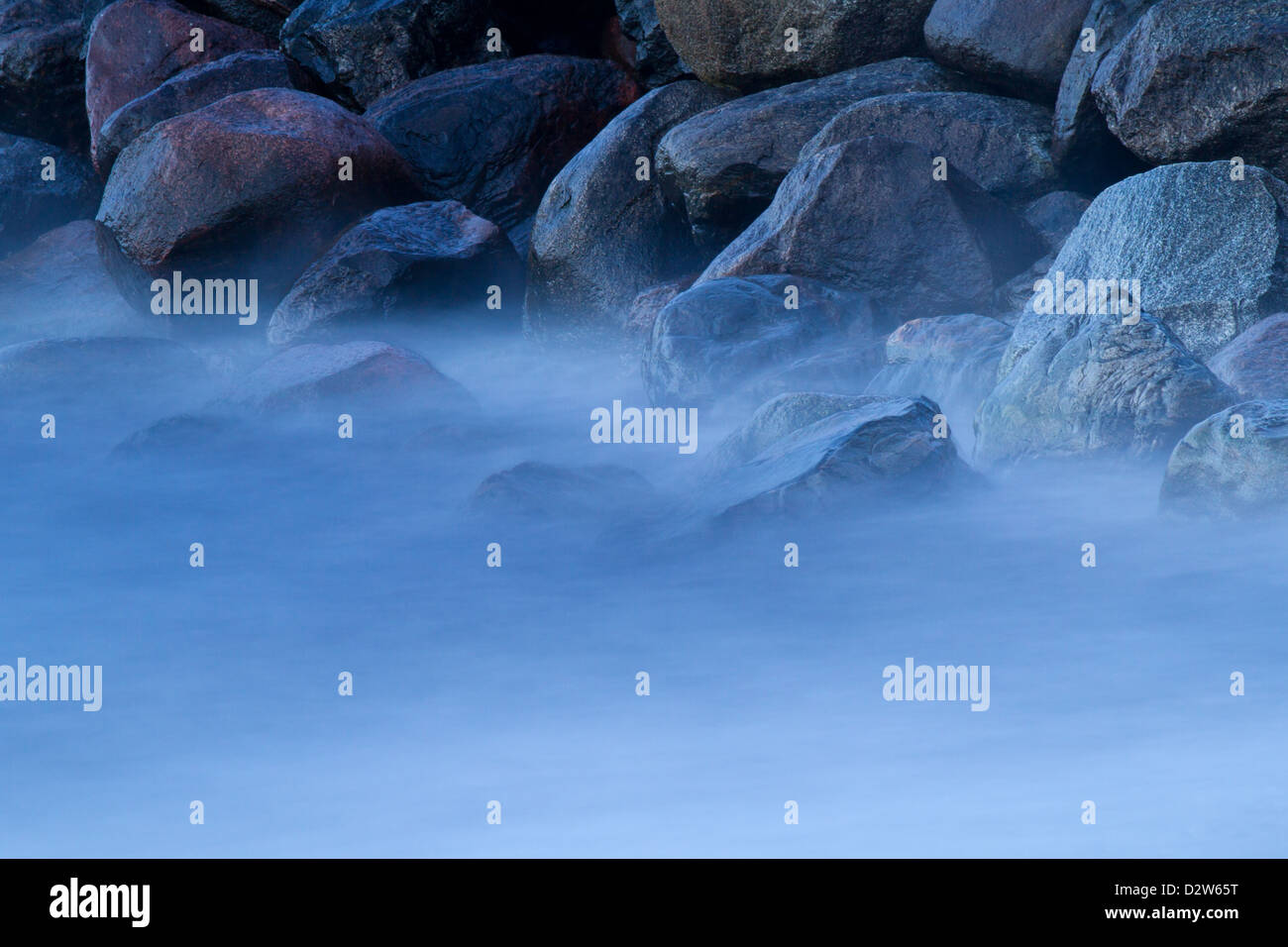 Very long exposure of waves hitting the rocks Stock Photo - Alamy
