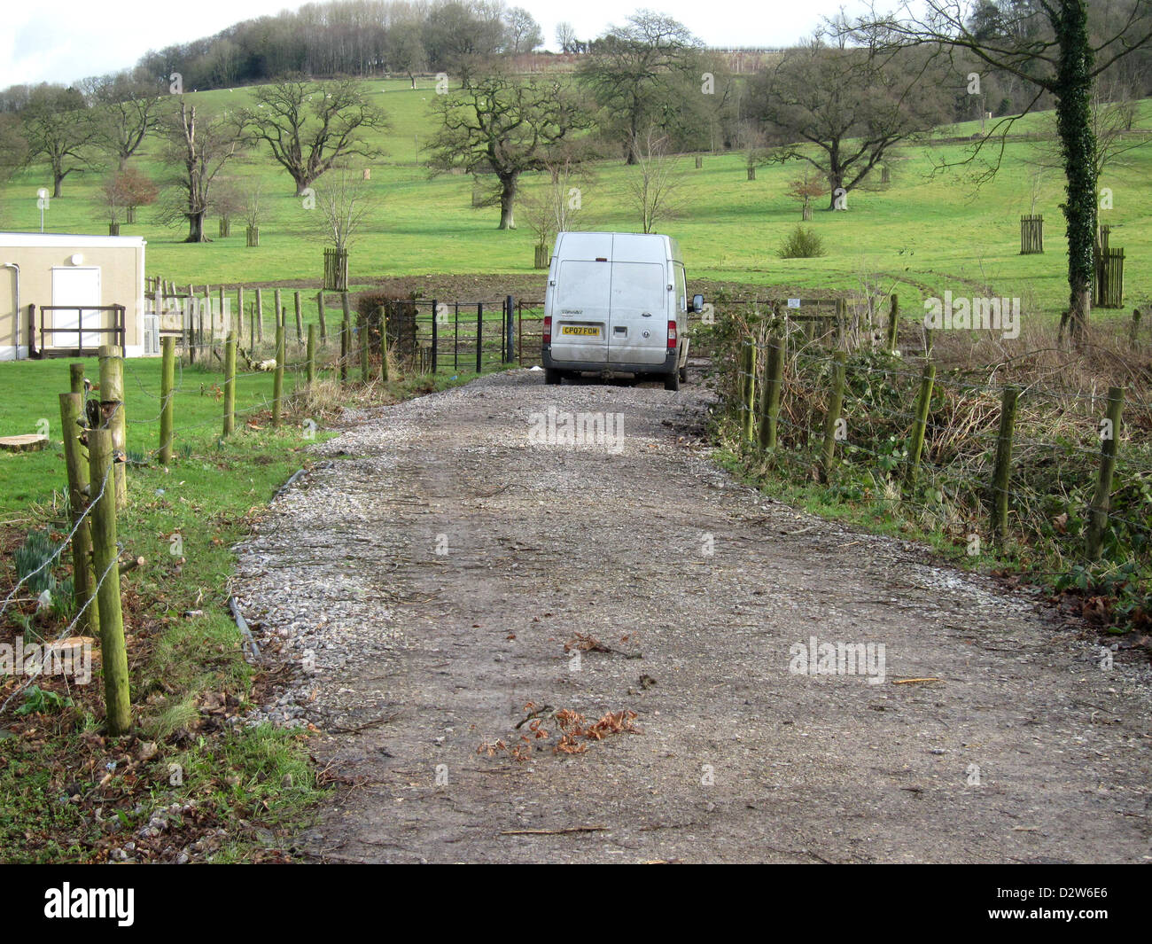 Van down a rural lane, heading for park land, picture taken on a public ...