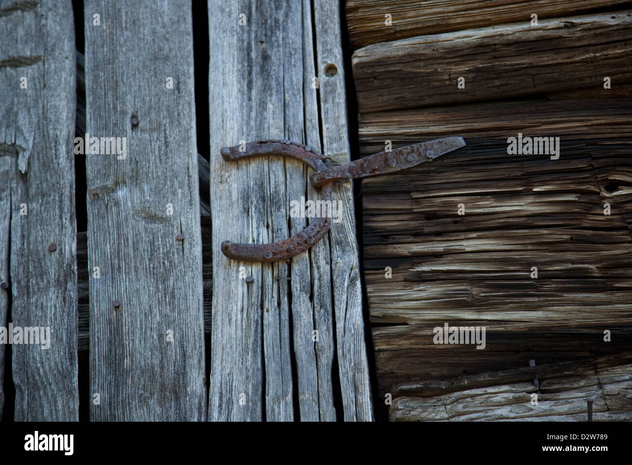 horse shoe hinge on a rough wooden door, a primitive solution to the ...