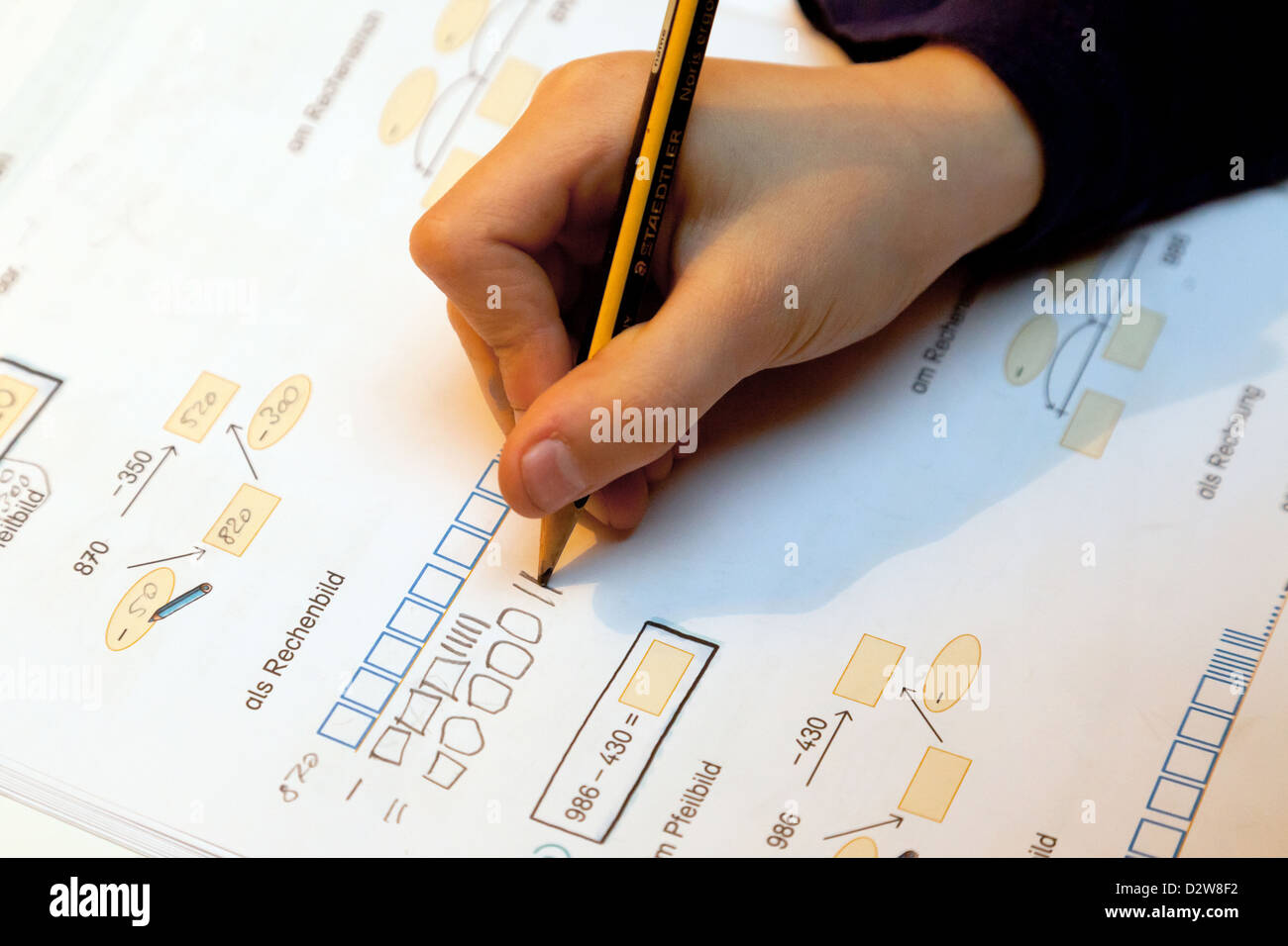 Berlin, Germany, Grundschuelerin on math homework Stock Photo - Alamy