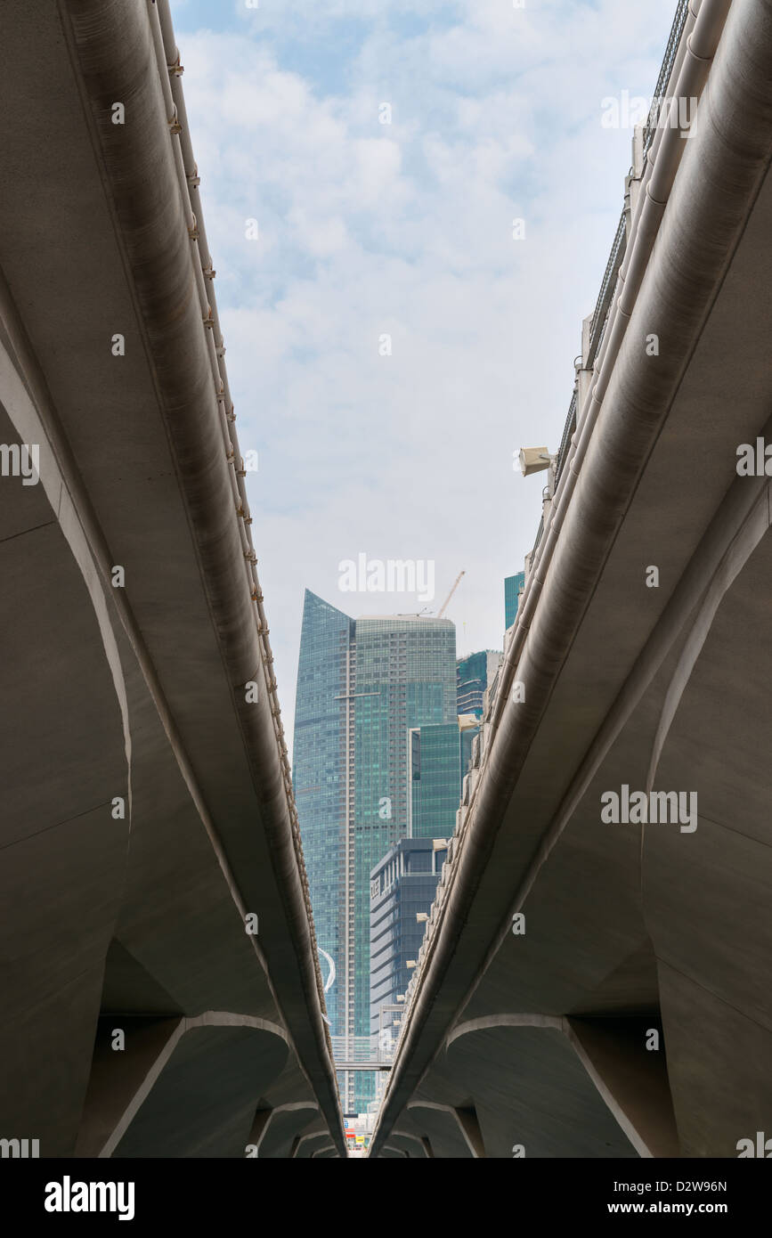 Skyscrapers and sky framed by modern concrete bridge Stock Photo - Alamy