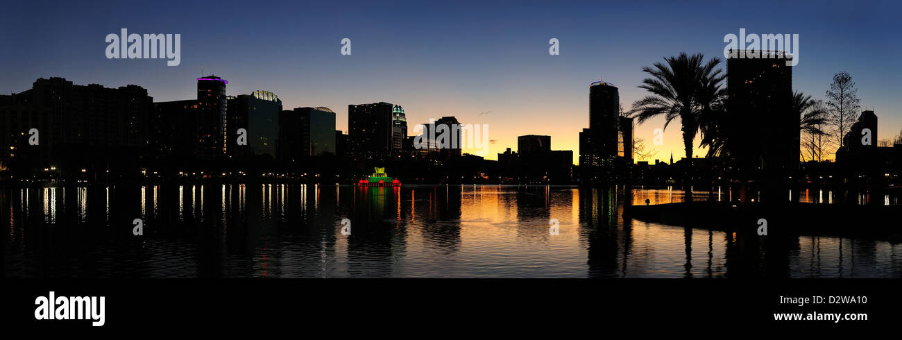 Orlando downtown skyline panorama silhouette over Lake Eola at dusk ...