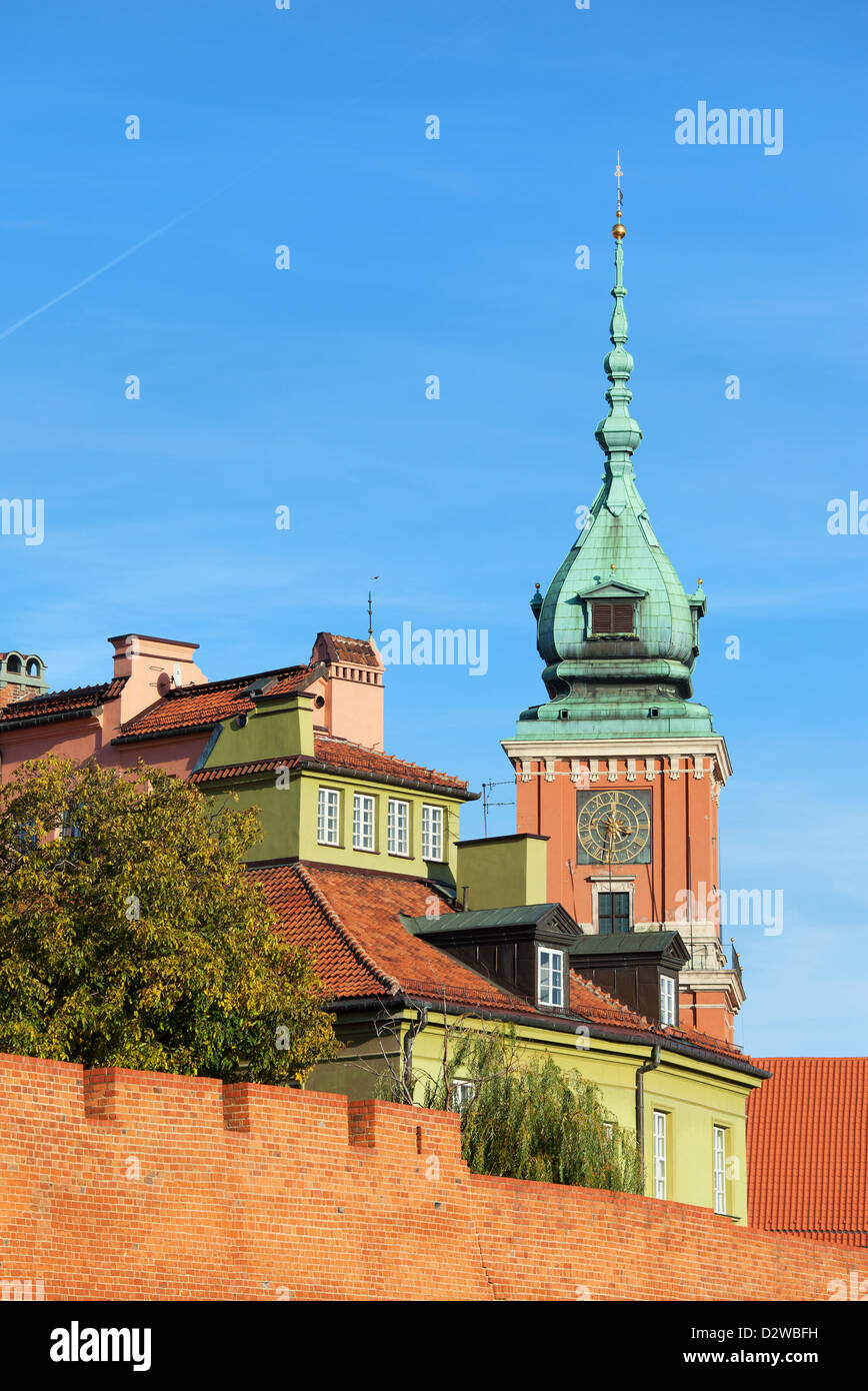 Clock tower of the Royal Castle, apartment buildings and city wall ...