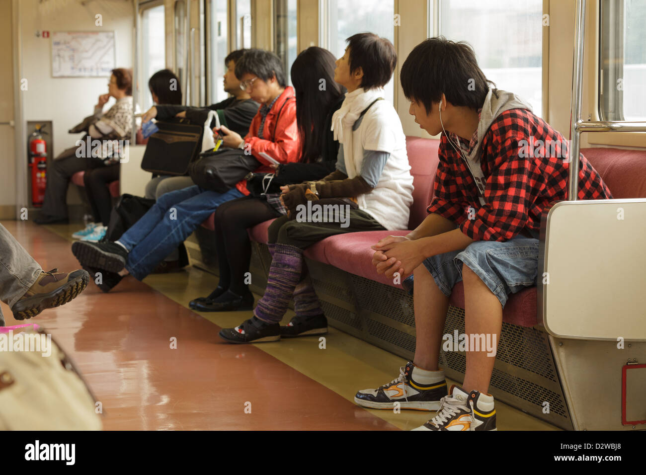 Passengers inside suburban commuter train, Kyoto, Japan Stock Photo - Alamy