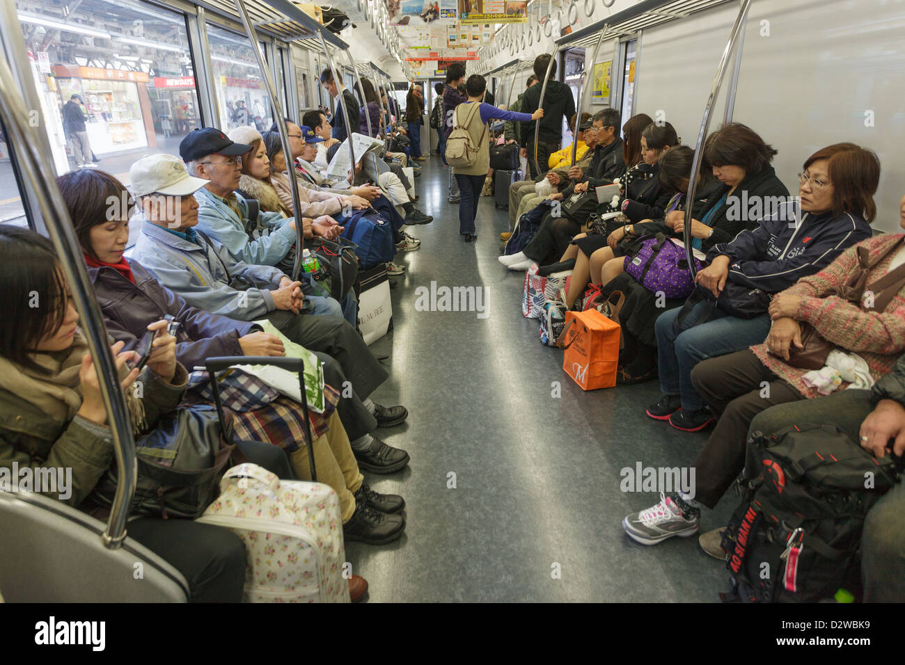 Woman sitting in metro carriage hi-res stock photography and images - Alamy