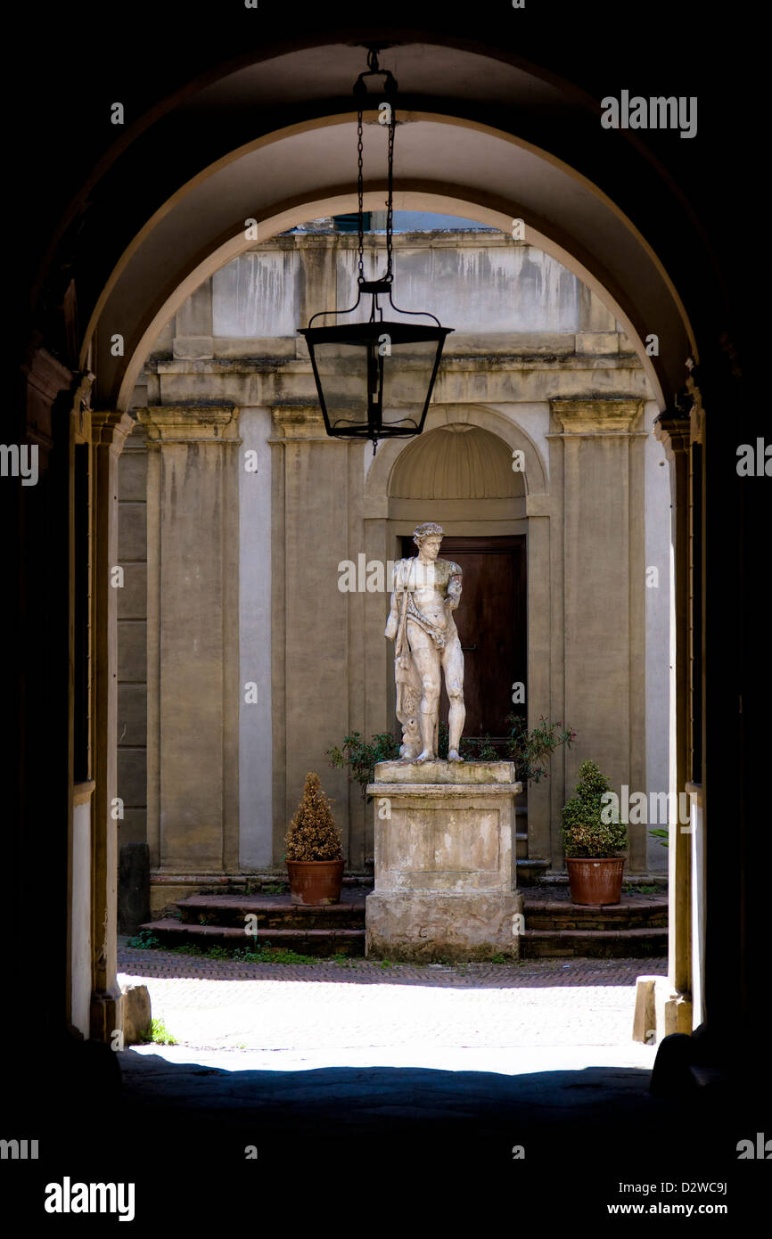 Marble statue in a courtyard, Siena, Italy Stock Photo - Alamy
