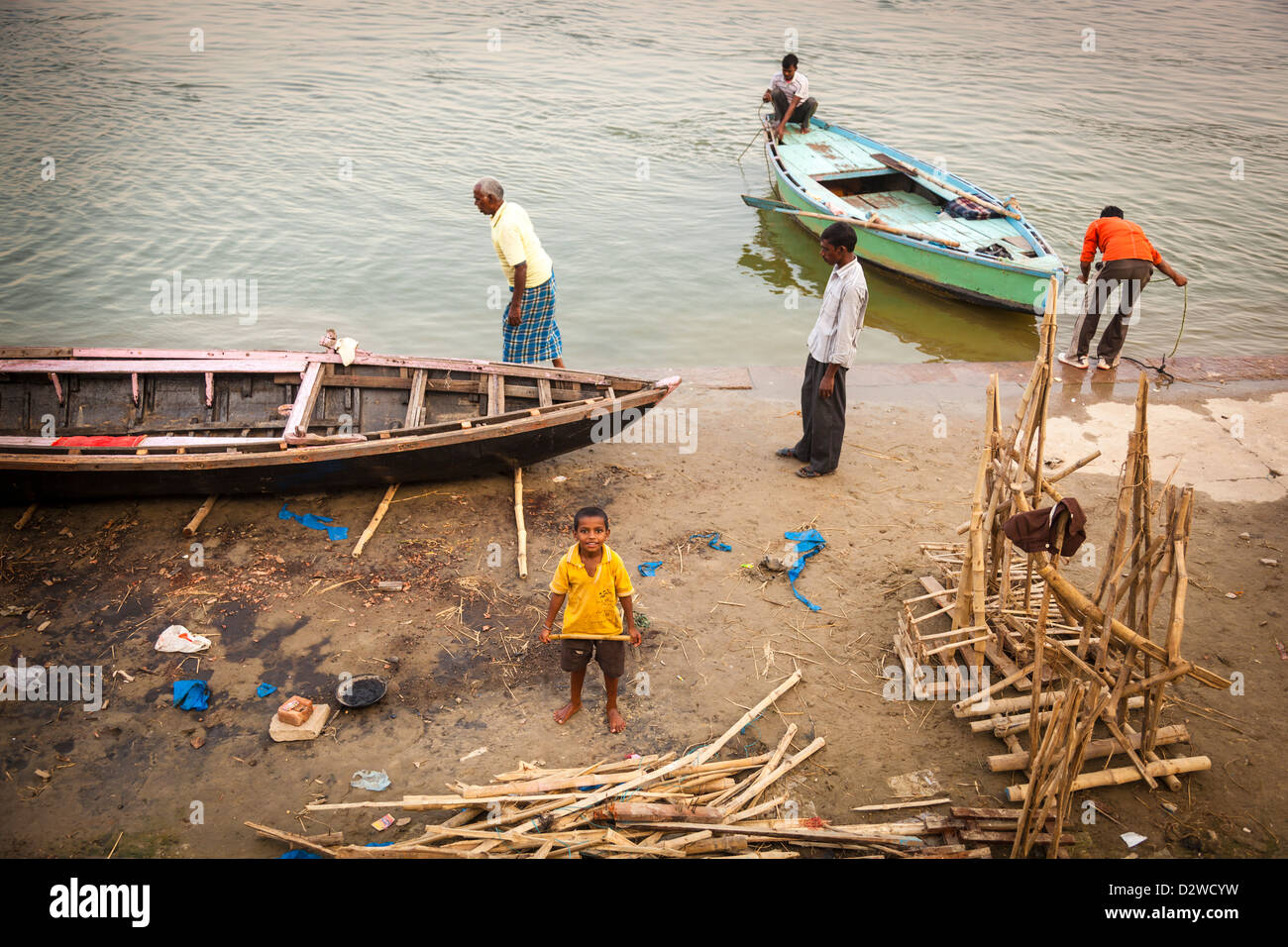 children playing on the banks of the Ganges river, Varanasi, India ...