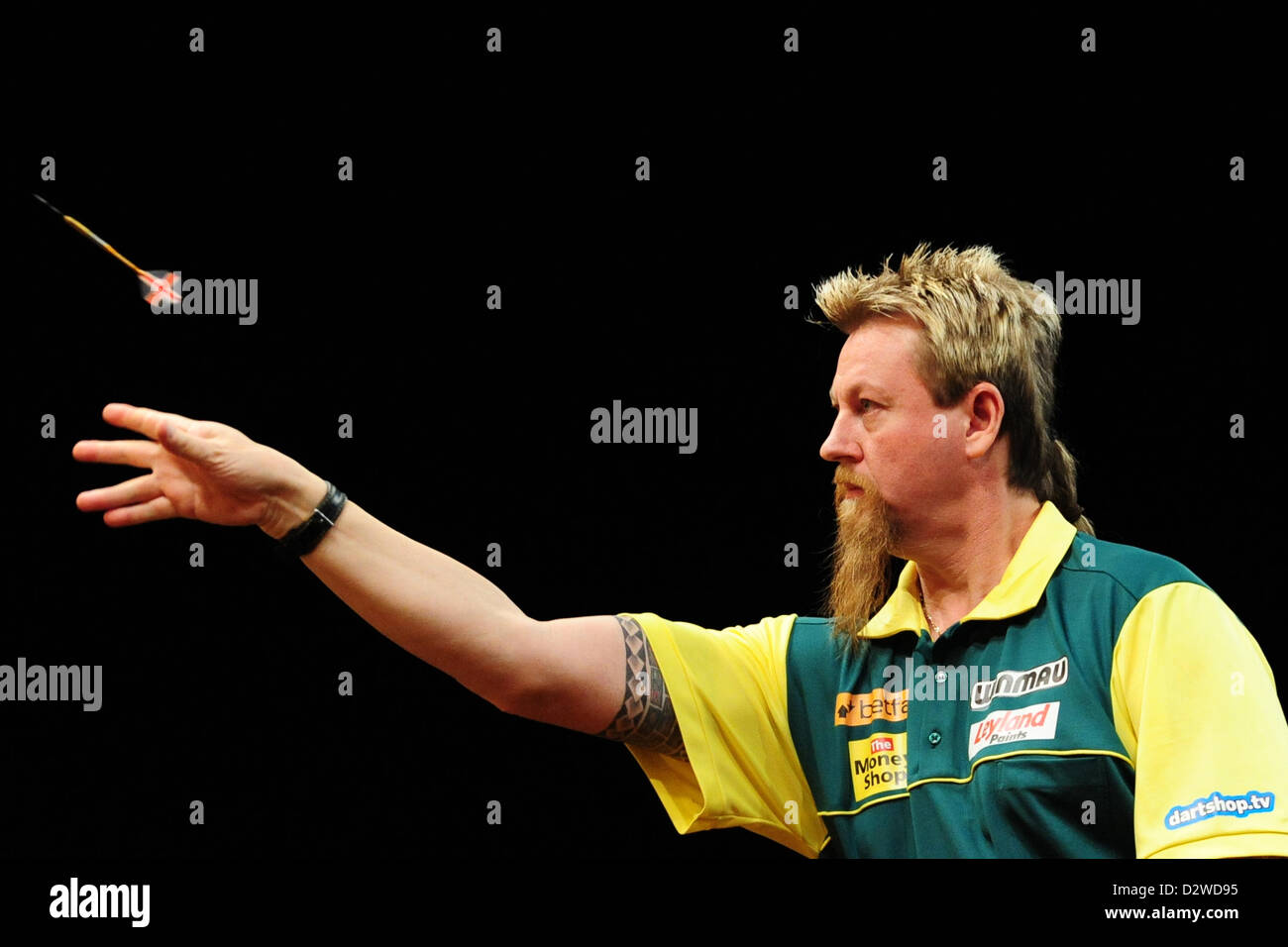 Australia's Simon Whitlock throws a dart at the 2013 Betfair World Cup ...