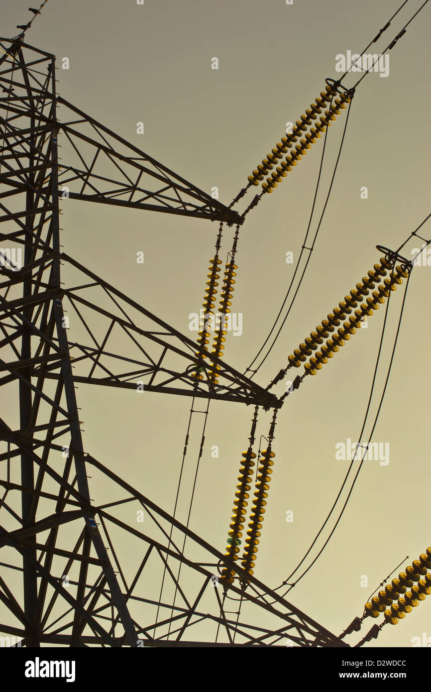 A shot looking up at electricity pylons with a beige sky Stock Photo ...
