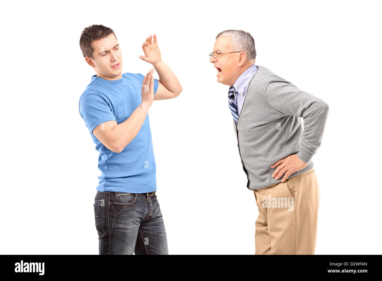 Mature man yelling at a young man isolated on white background Stock ...
