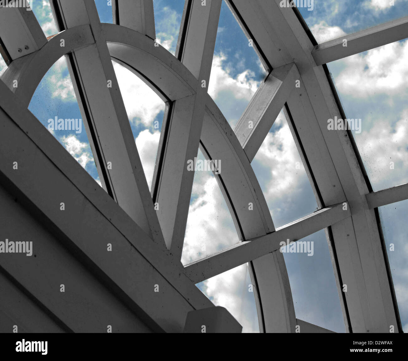 The sky as seen through the glass panes of a decorative ceiling canopy ...