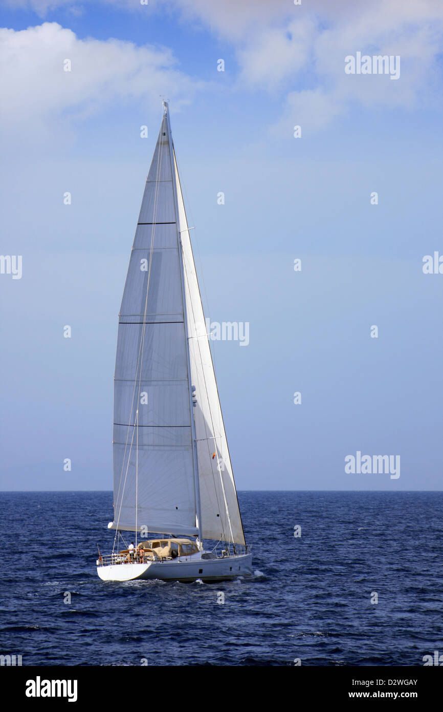 Sloop sailing in open waters Stock Photo - Alamy