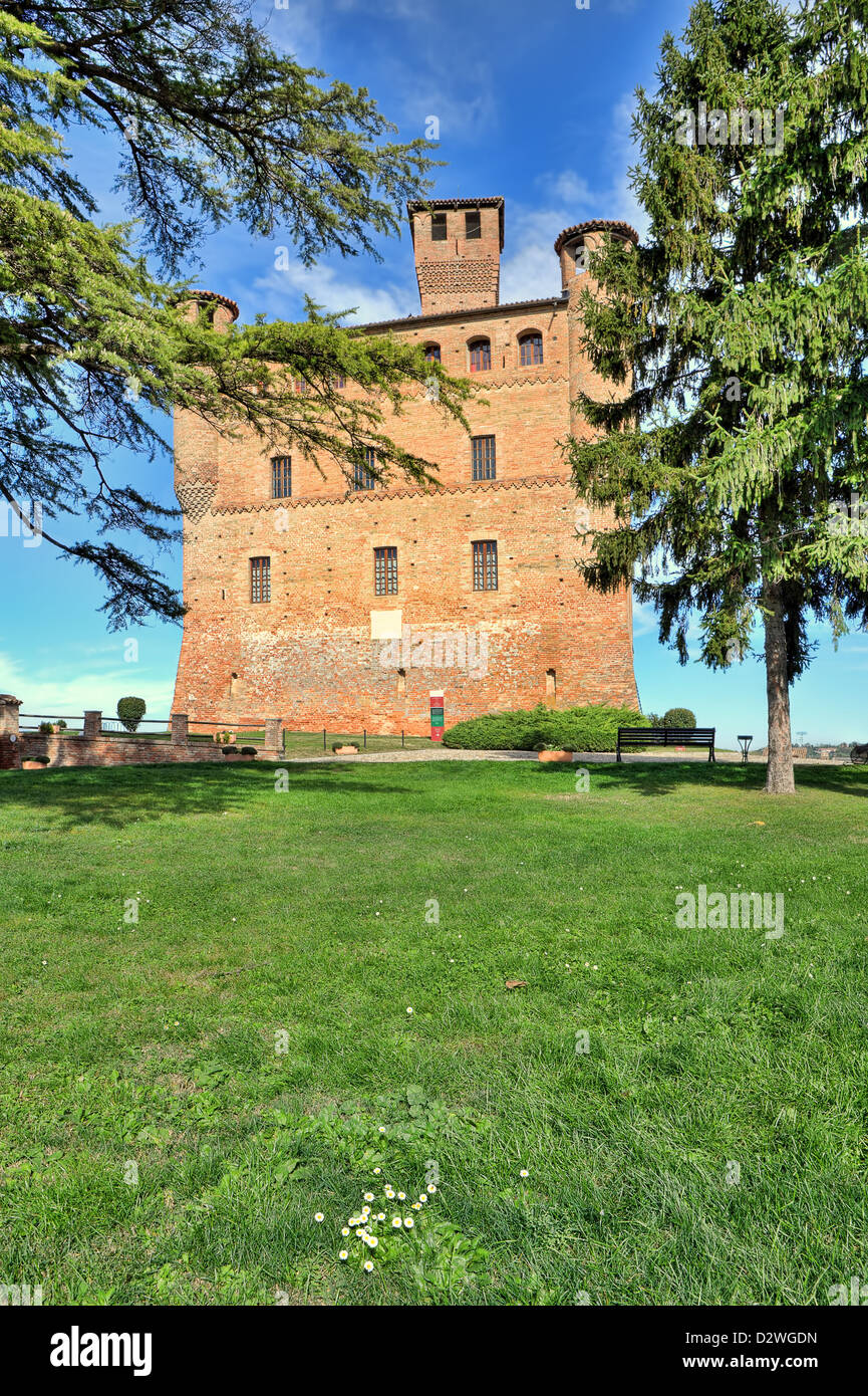 Vertical oriented image of ancient castle among trees at Grinzane ...