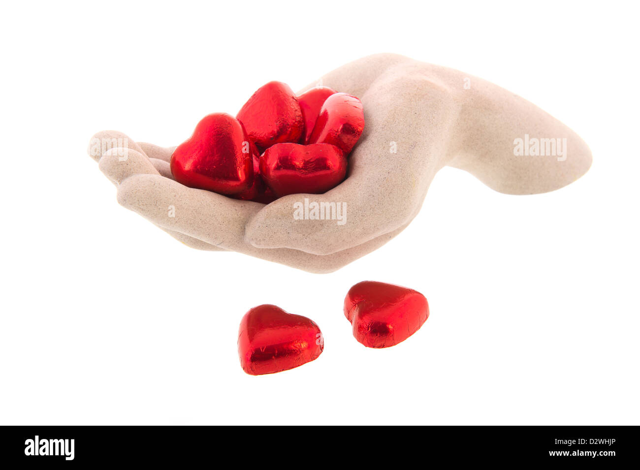 Giving candy hearts with hand for love Stock Photo - Alamy