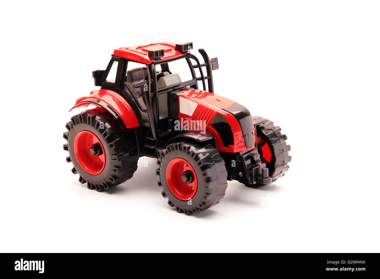 Red and black model tractor isolated on white background Stock Photo ...
