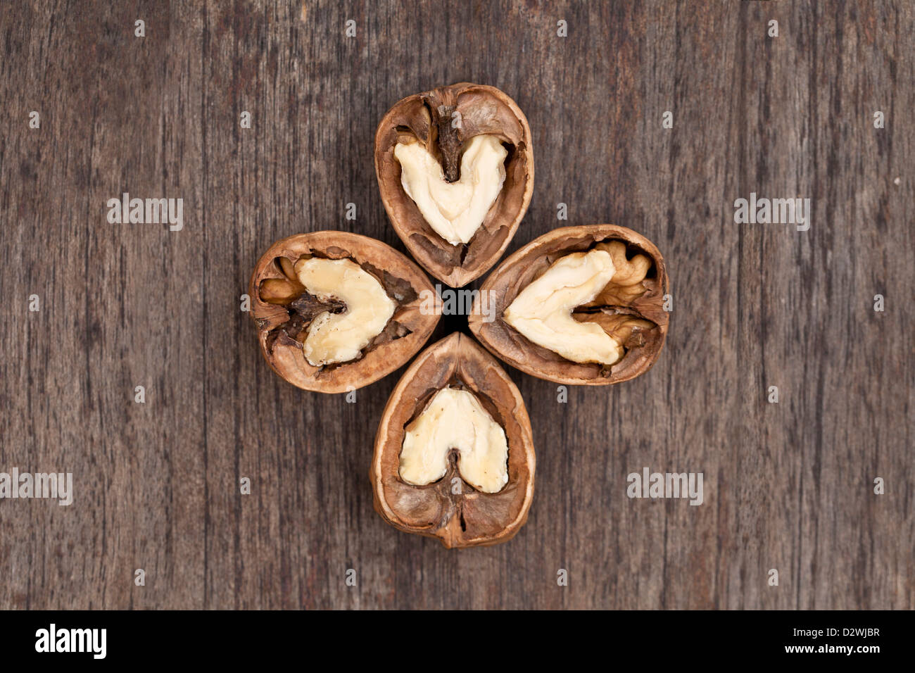 Four walnuts with a heart shaped interior Stock Photo - Alamy