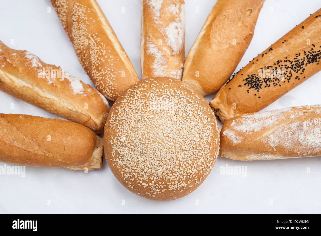 Selection of baguette french sticks with a bread loaf isolated on a ...